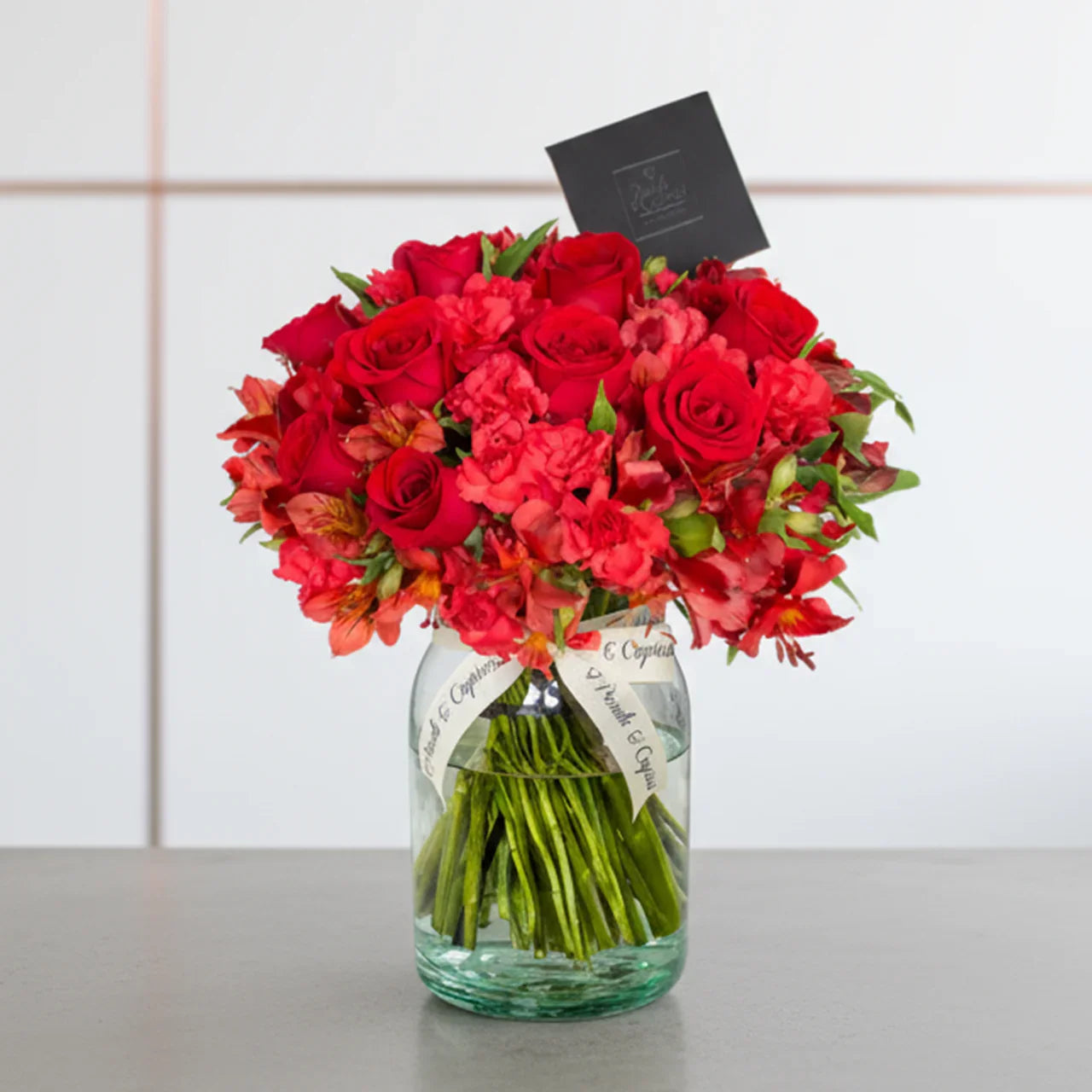 Floral arrangement of 12 roses, carnations, and alstroemeria | Send ...